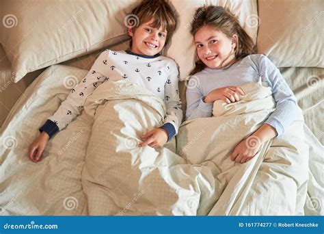 Brother And Sister Are Lying In Bed Stock Image Image Of Sister Lifestyle 161774277