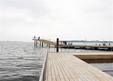 Sloped Decking Creates Waterfront Slides At Faaborg Harbour Bath