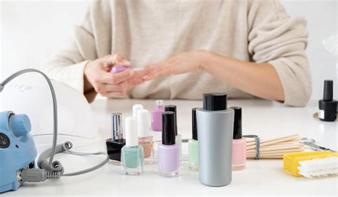 Premium Photo Woman Doing Manicure At Home Drilling The Nails
