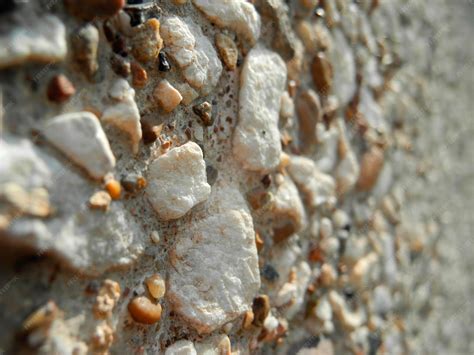 회색 작은 바위 지상 질감 자갈 자갈 돌 원활한 질감 짓 눌린된 화강암 자갈의 배경 가까이 프리미엄 사진