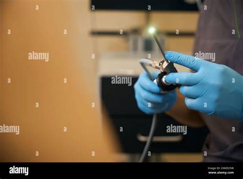 Experienced Proctologist Is Preparing For Anoscopy Procedure Stock