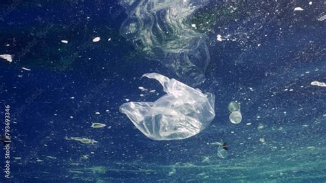 Plastic Trash Floating Of Polluted Water Reflecting On Surface Massive