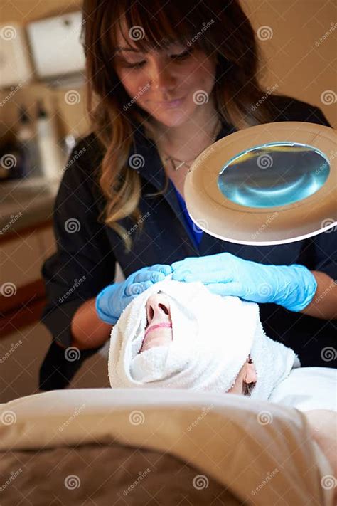 Woman Having Dermo Abrasion Cosmetic Treatment At Spa Stock Image