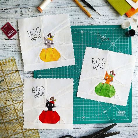 Three Pieces Of Fabric With Cats On Them And Some Sewing Supplies Next To Each Other