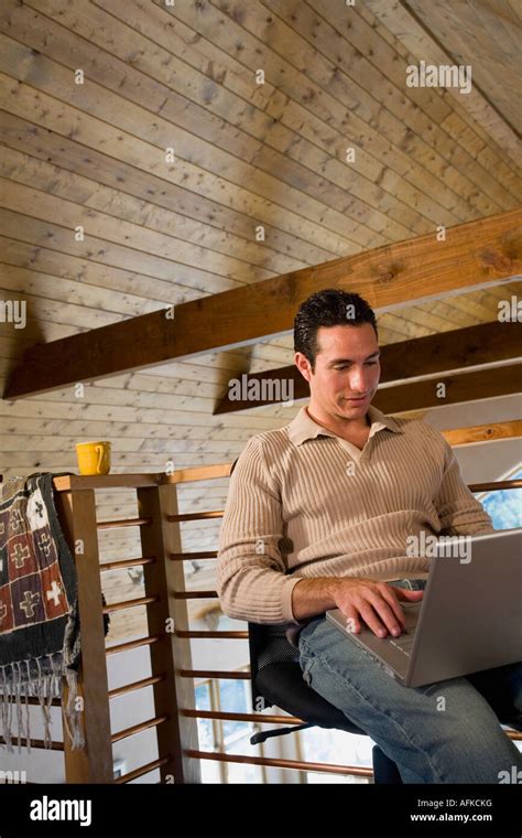 Mid Adult Man Using A Laptop Stock Photo Alamy