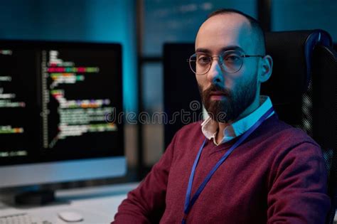 Computer Programmer Looking At Camera With Code Lines Stock Image