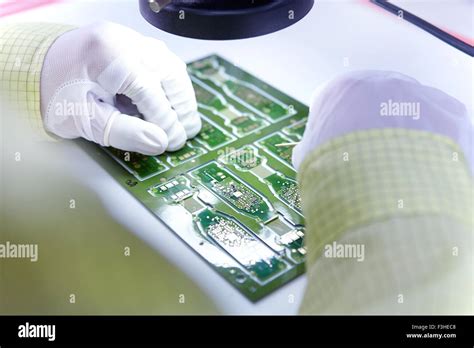Young Woman Working Factory Producing Flexible Electronic Circuit