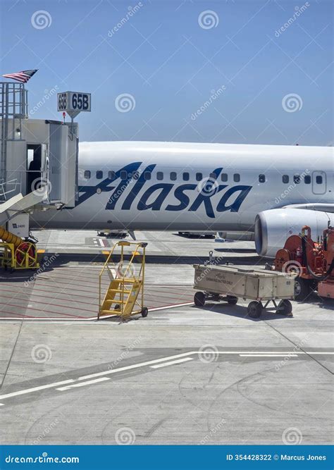 An Alaska Airlines Plane On The Tarmac At The Terminal At Lax Airport