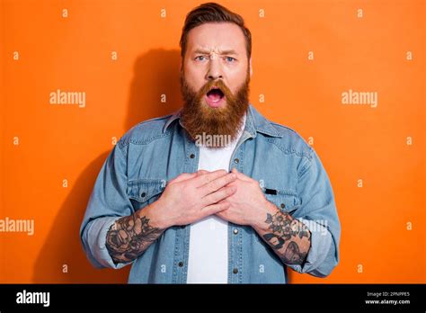 Photo Of Shocked Young Man Hands Touch Chest Open Mouth Stare Disbelief