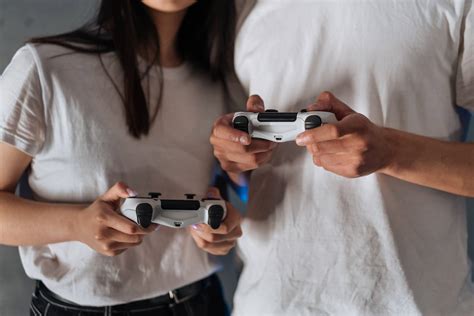 Download Couple Hands Gaming Controllers Wallpaper