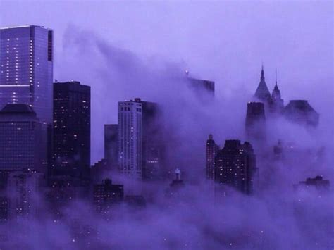 The City Skyline Is Covered In Fog And Smoggy Clouds As It Sits On Top