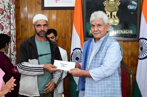 LG Hands Over Land Allotment Orders To Landless Beneficiaries Of PMAY G