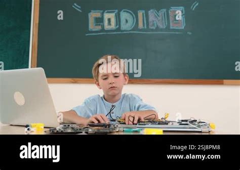 Student Working On Electronic Board While Sitting At Stem Class With