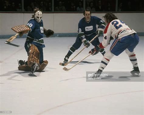 Ed Dyck Of The Vancouver Canucks Saves A Shot Taken By Chuck Lefley