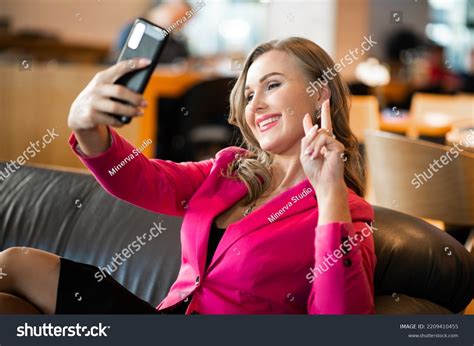 Photo Happy Seductive Woman Winking Gesturing Stock Photo 2209410455
