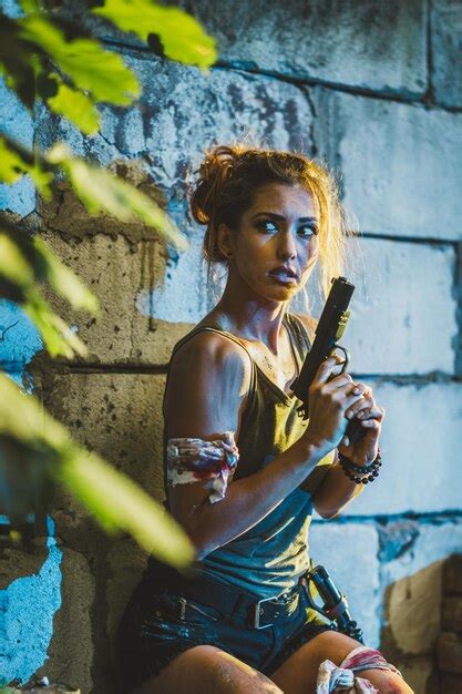 Premium Photo Woman Holding A Gun