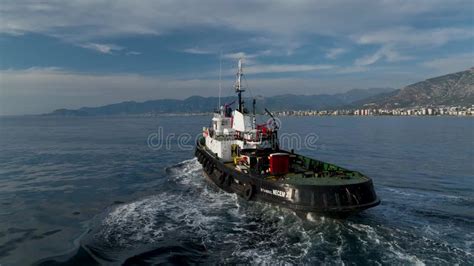 Sea Tug Sails To The Port On A Mission Aerial View 4k Stock Footage