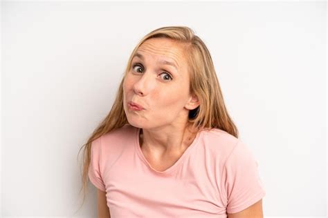 Premium Photo With A Goofy Crazy Surprised Expression Puffing Cheeks Feeling Stuffed Fat And