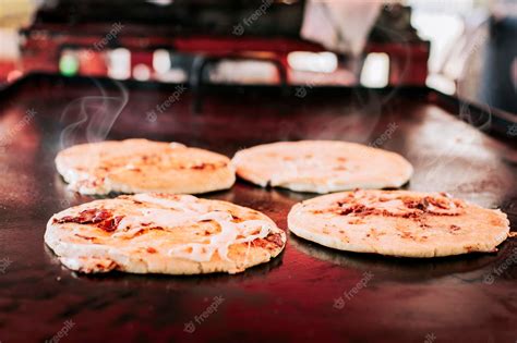 Premium Photo Traditional Salvadoran Pupusas With Melted Cheese On A