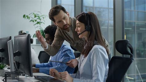 Multinational Call Center Office Conflict Angry Displeased Caucasian Male Supervisor Scolds