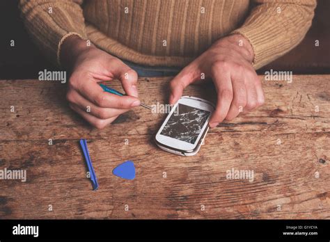 A Technician Is Fixing And Replacing The Broken Screen On A Smart Phone Stock Photo Alamy