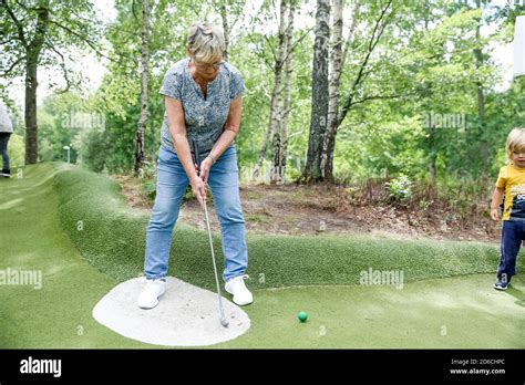 Woman Playing Mini Golf Stock Photo Alamy Woman Playing Mini Golf Stock Photo Alamy