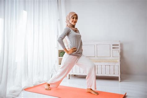Premium Photo Muslim Hijab Woman Warming Up Before Exercise Home Work