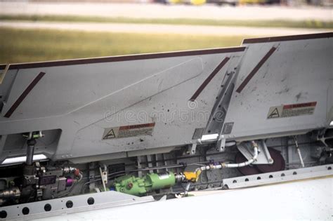 Detail Of The Wing Of An Airplane With The Flaps In Motion During The Landing Stock Image