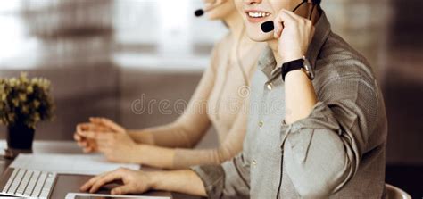 Smiling Young Businessmen And Programmers Are Checking Some Data On