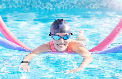 Active Exercise Senior Woman Over Age Of 50 In Goggles Cap Doing