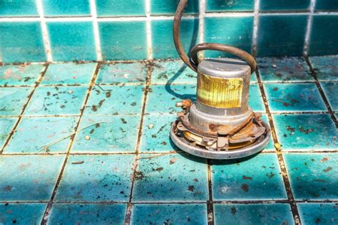 Old And Rusty Pool Light On Swimming Pool Floor Illumination System