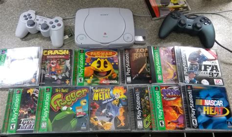 Barely Used PS With Controllers Memory Cards And Games Some Still In Original Packaging
