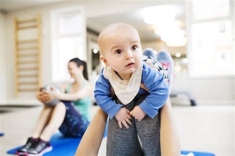 Baby As Part Of Mother S Exercise Fitness Seasson Group Exercise