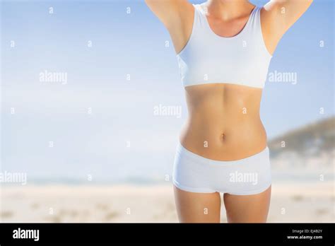 Composite Image Of Gorgeous Fit Blonde Making Heart Shape With Hands By