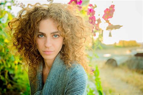 Download Curly Haired Woman Outdoor Portrait Wallpaper Wallpapers Com