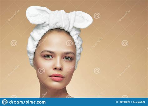 A Young Beautiful Girl In A Bandage Smiling With Closed Eyes And Bare
