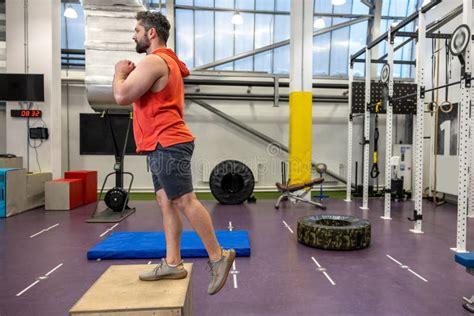 Man In Sportswear Doing Step Up Workout With Wooden Box In Crossfit Gym Stock Photo Image Of