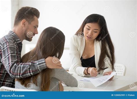 Spouses Visiting Real Estate Agent To Buy House Together Stock Image