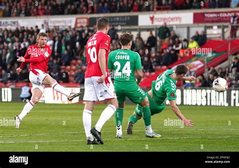 Wrexhams Andy Cannon Left Attempts A Shot On Goal During The