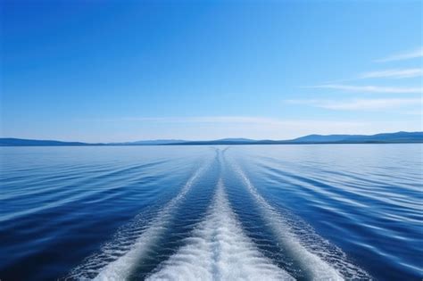 Premium Photo Motorboats Wake Pattern In Calm Lake Water