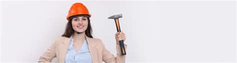 Premium Photo Girl Engineer In An Orange Construction Helmet With A