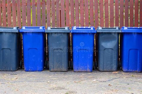 Wheelie Bins In Row For Refuge Collection Outside Council Residential