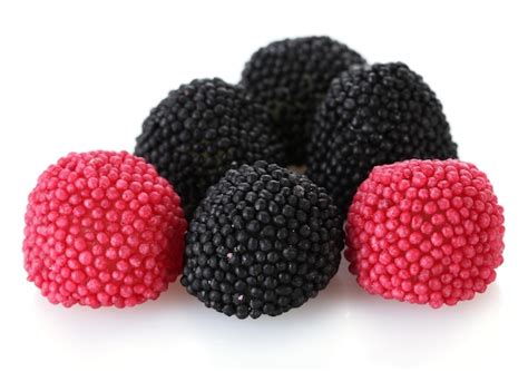 Premium Photo Red And Black Candy Berries Isolated On White