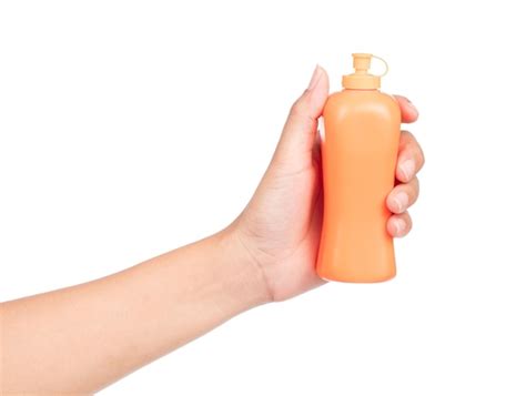 Mano Sujetando Una Botella De Plástico Naranja Aislado Sobre Fondo