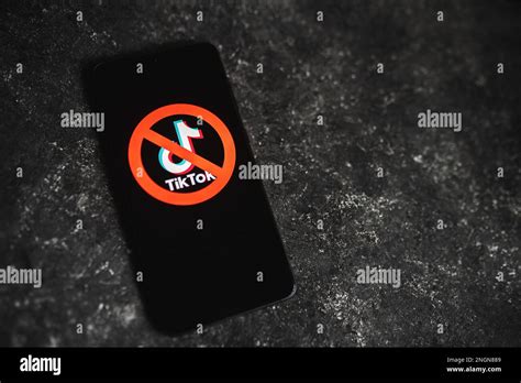 Tiktok App Logo Crossed Out With Red Ban Sign Displayed On Phone Screen