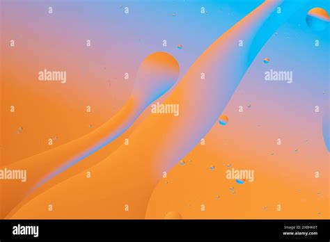 Colorful Abstract Image With Flowing Transitions Of Orange And Blue Forming A Dynamic And