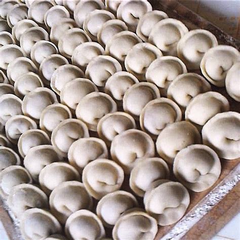 there are many doughnuts on the table ready to be baked