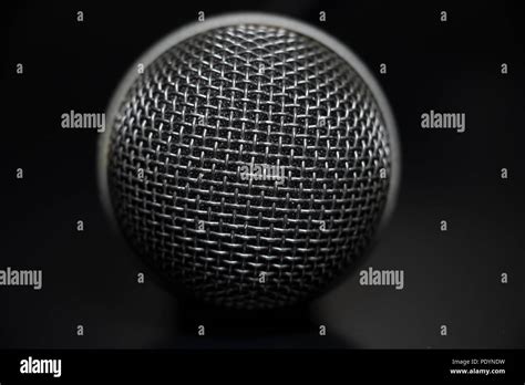Microphone Close Up Grid Texture Of A Microphone With Black Background