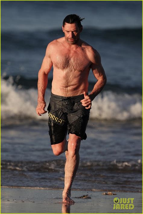 Hugh Jackman Runs Shirtless On The Beach With His Ripped Muscles On