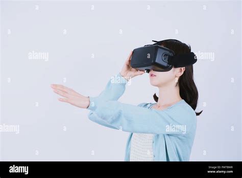 Japanese Woman Using Virtual Reality Device Stock Photo Alamy